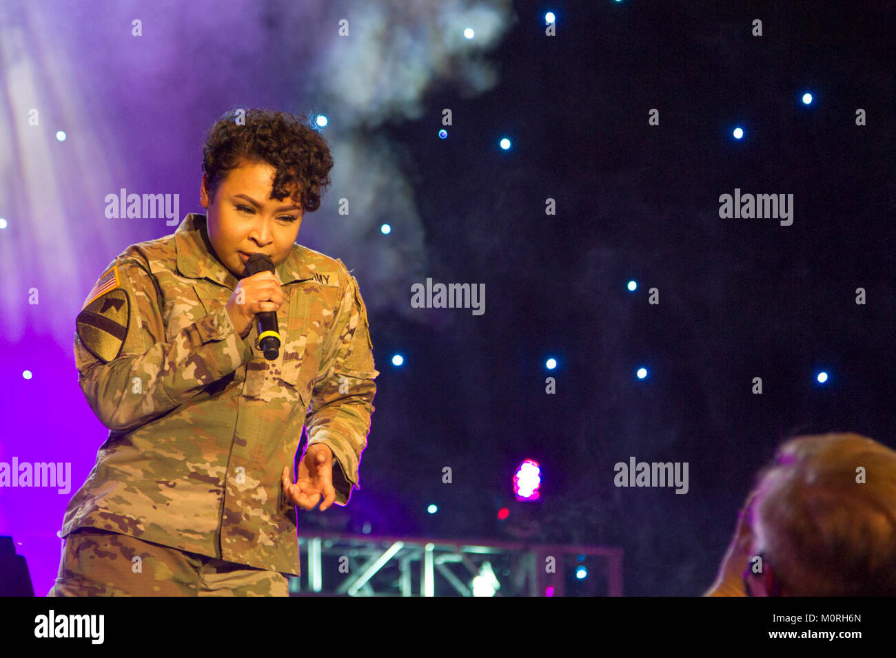 Staff Sgt. Kyra White, a vocalist with The Six String Soldiers, belts ...