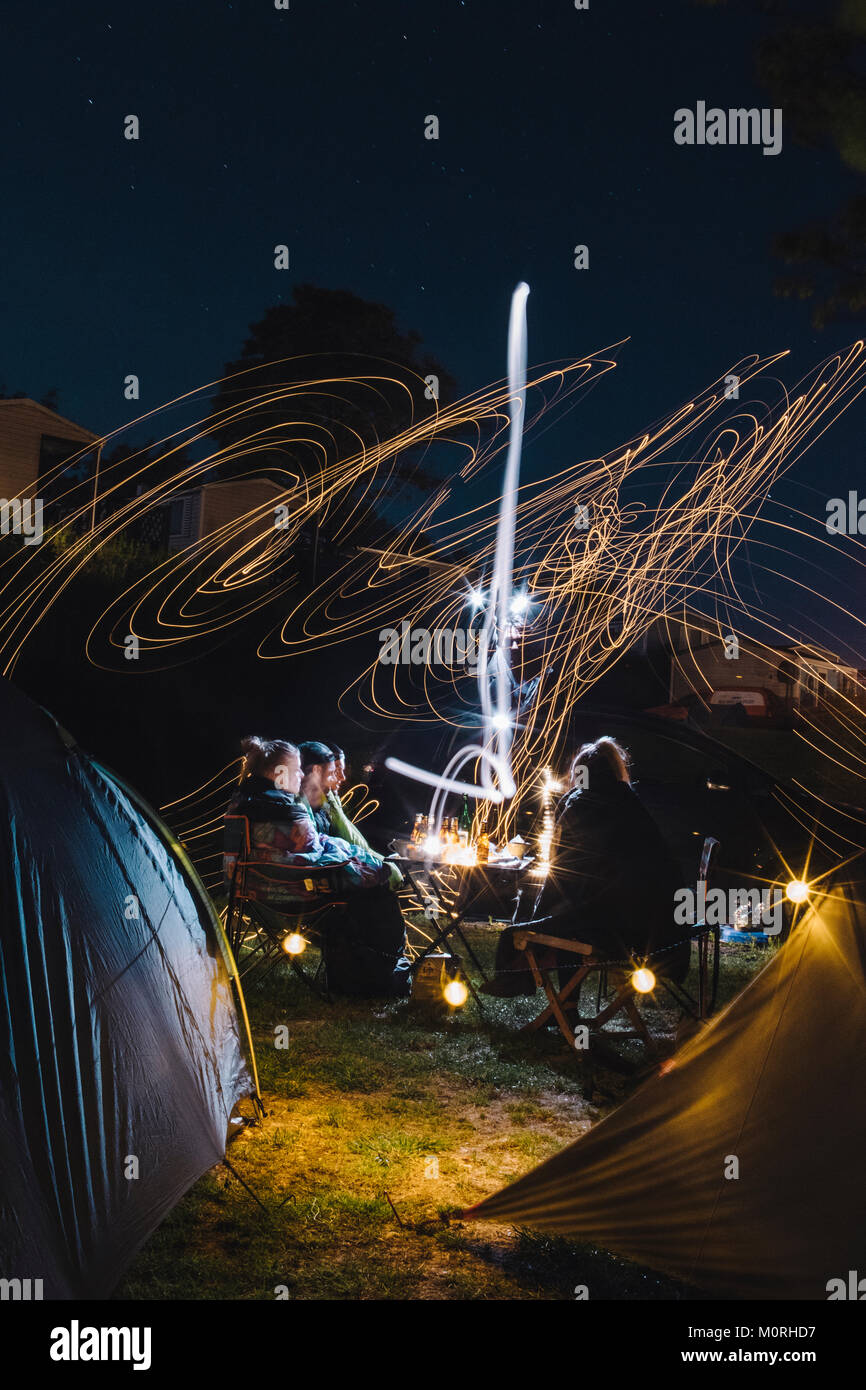 France, group of friends camping at night Stock Photo - Alamy
