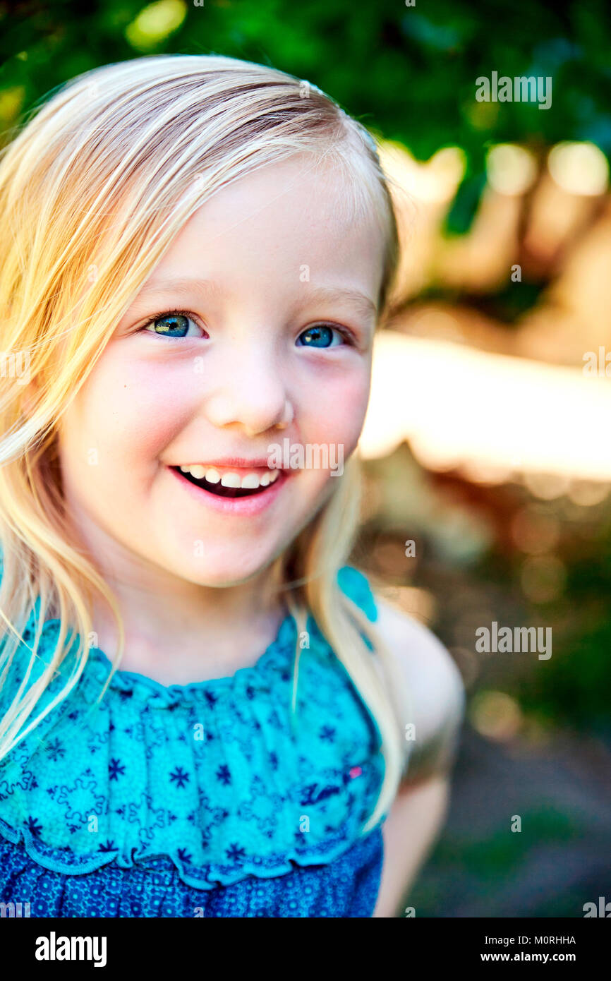 Portrait of happy girl outdoors Stock Photo - Alamy