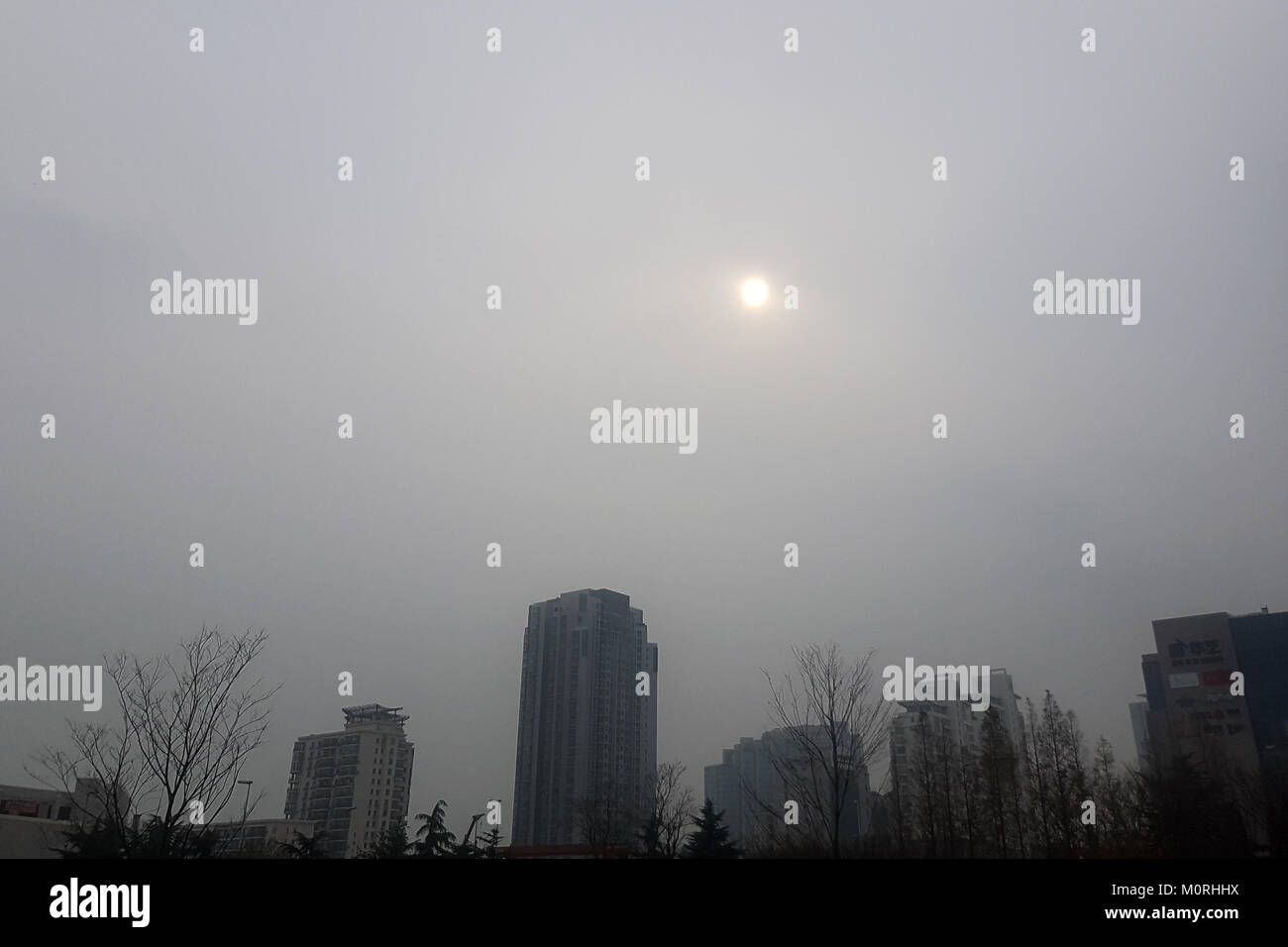 08-12-2016 - Qingdao China - the faint sun clouded by winter pollution ...