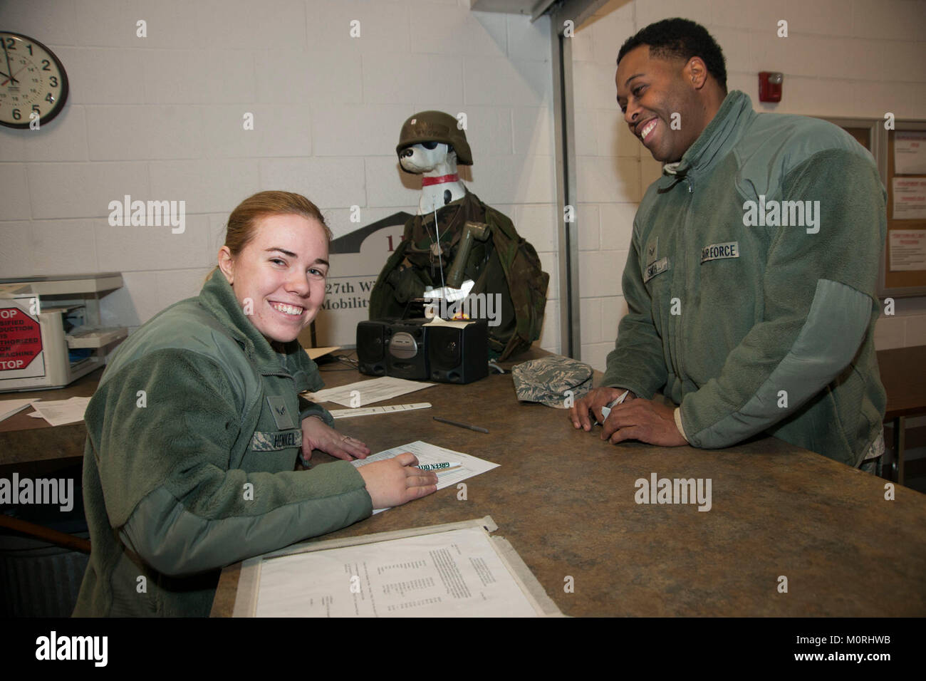 Airman 1st Class Sarah Henkel distributes deployment gear to Senior ...
