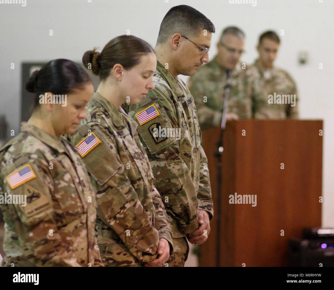 The official party bows their heads for the invocation during the 198th ...