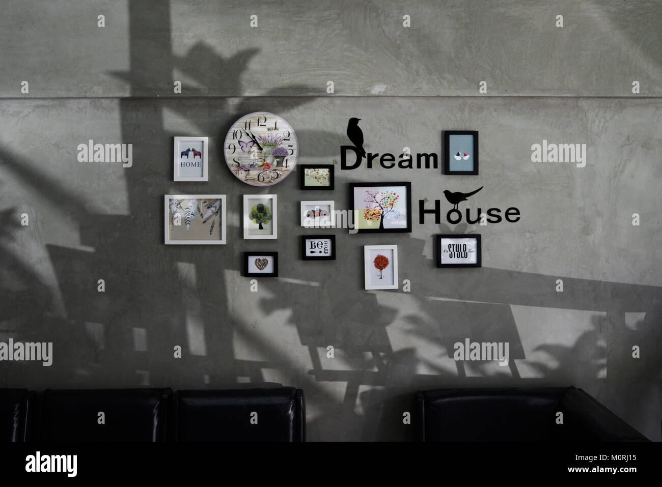 Home decor frames with Dream House word hanging on a grey wall Stock ...