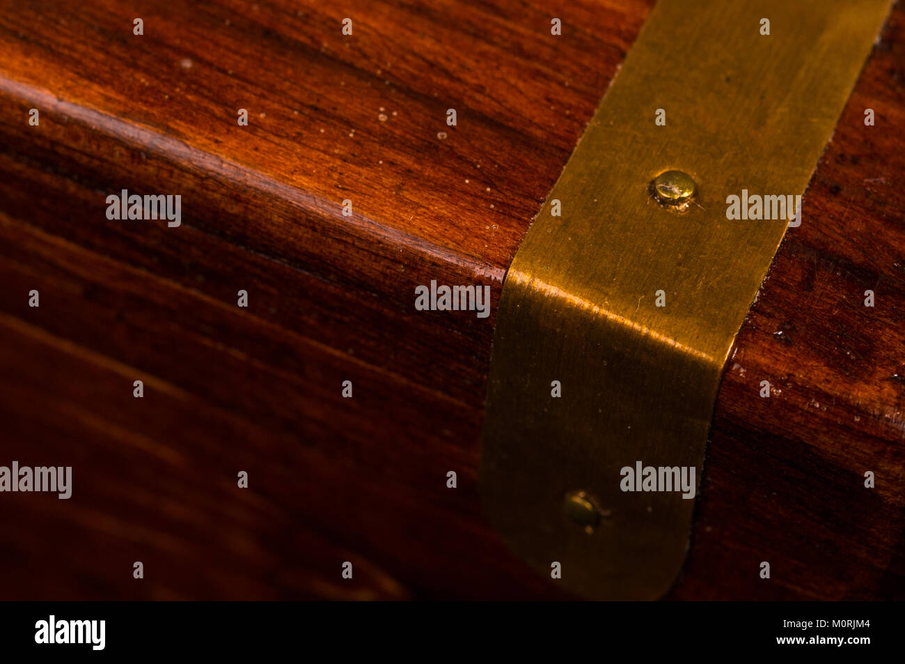 dark weathered teak wood with copper details, close up Stock Photo - Alamy