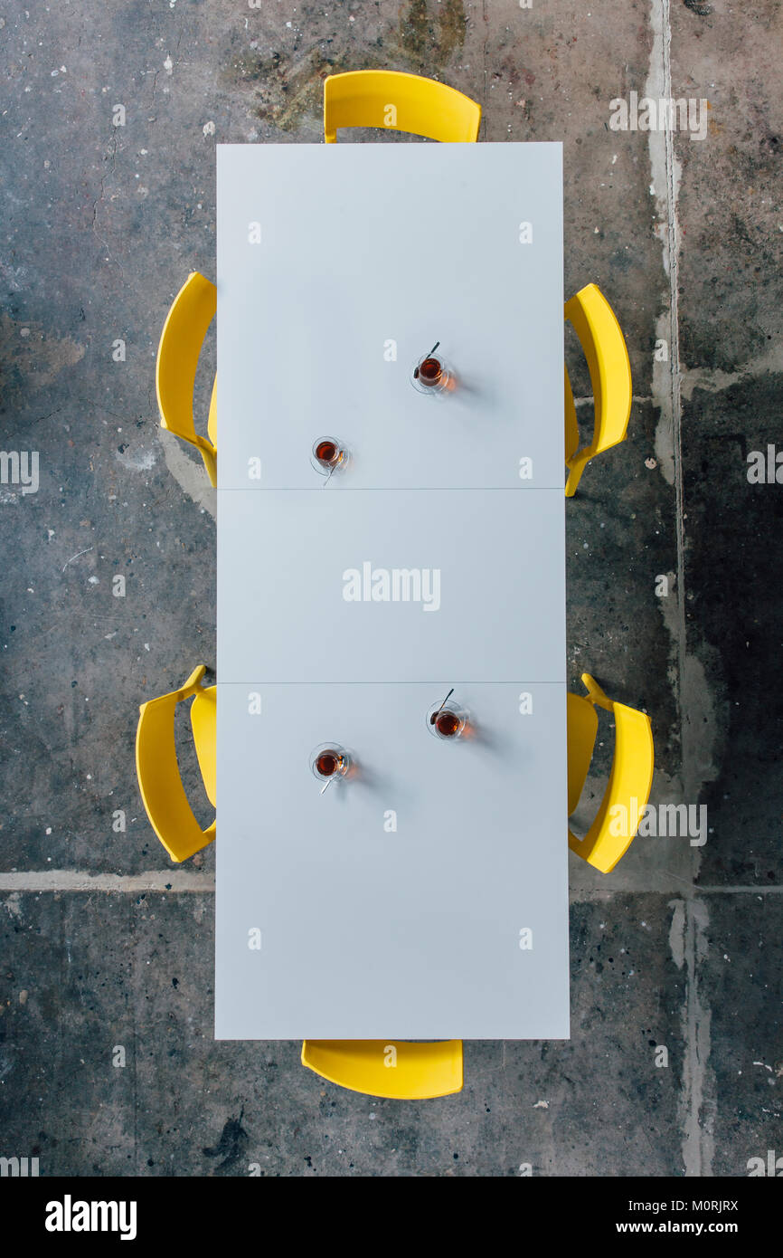 Conference table with turkish tea cups seen from above Stock Photo - Alamy