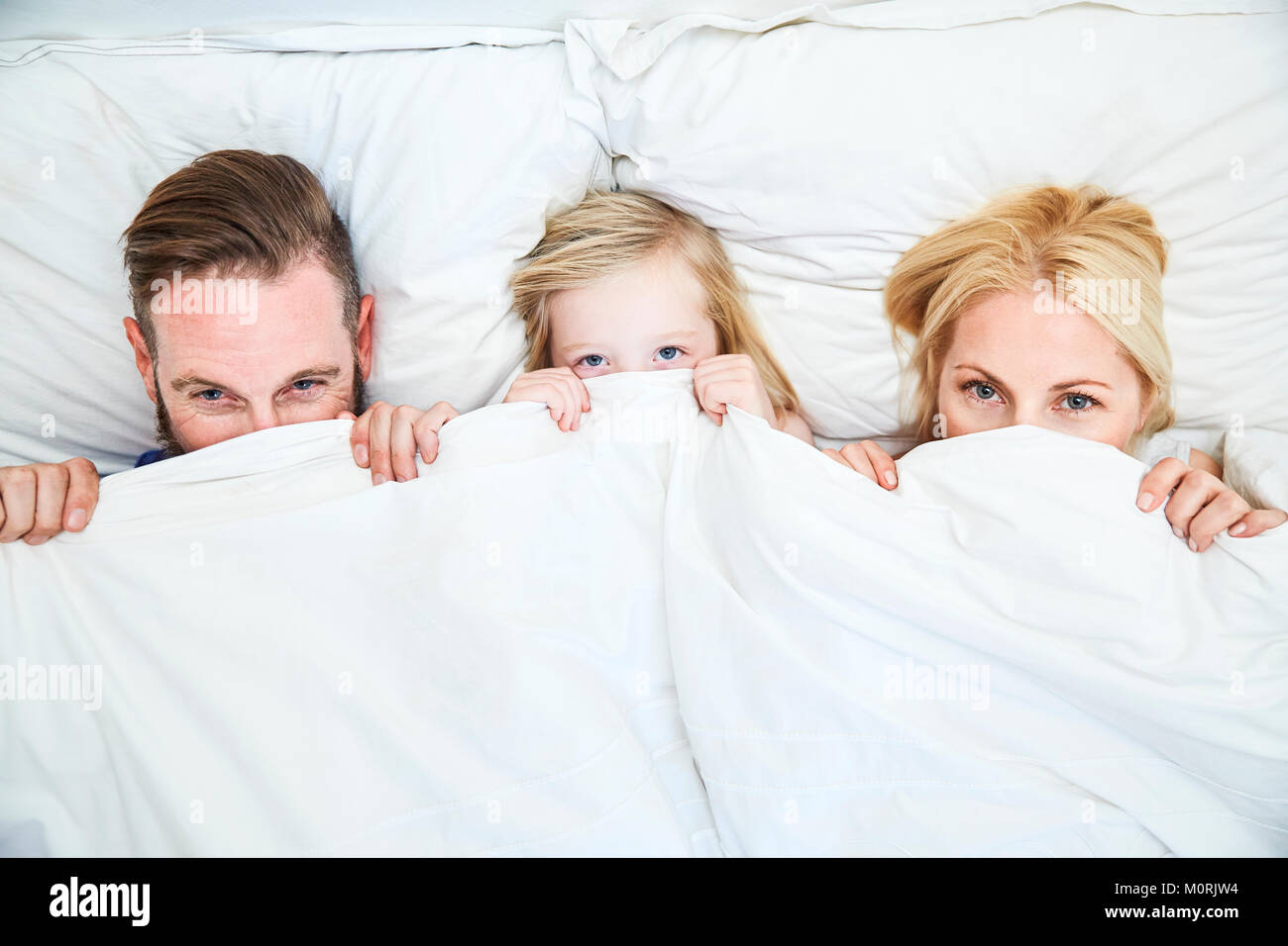 Hiding under bed man woman hi-res stock photography and images - Alamy