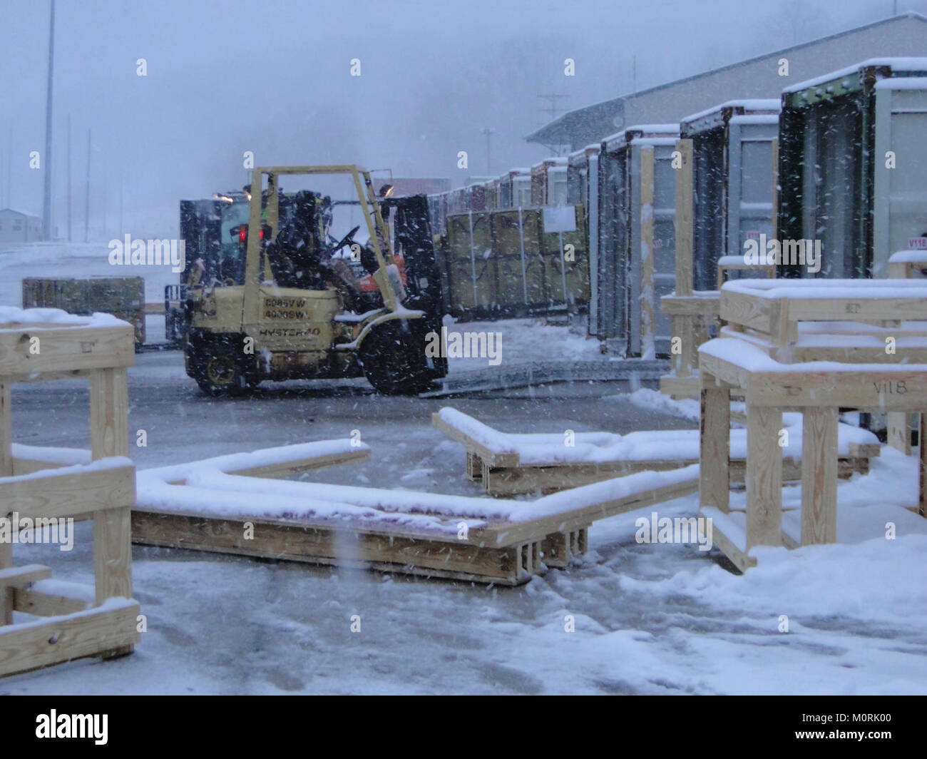 Crane Army Ammunition Activity employees work through snow, ice, sleet ...