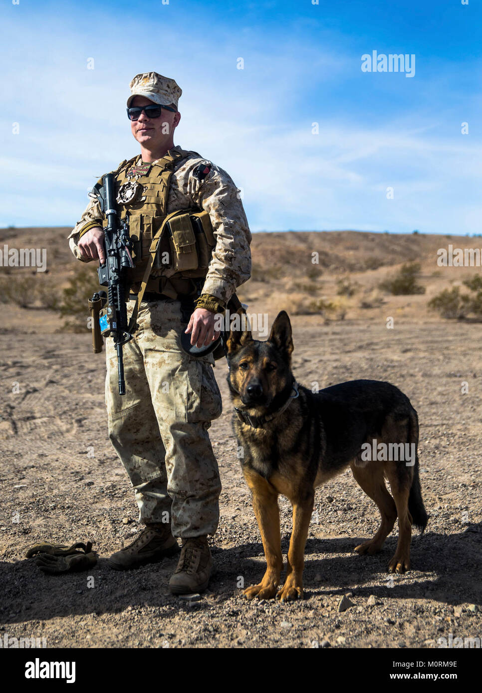 Sgt. Lary, a military working dog, and Cpl. Kevin Kelly, military ...