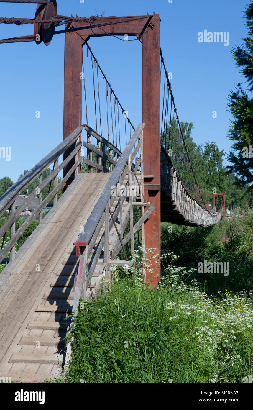 Suspension bridge over the river Vaga in the village Verkhovazhye of ...