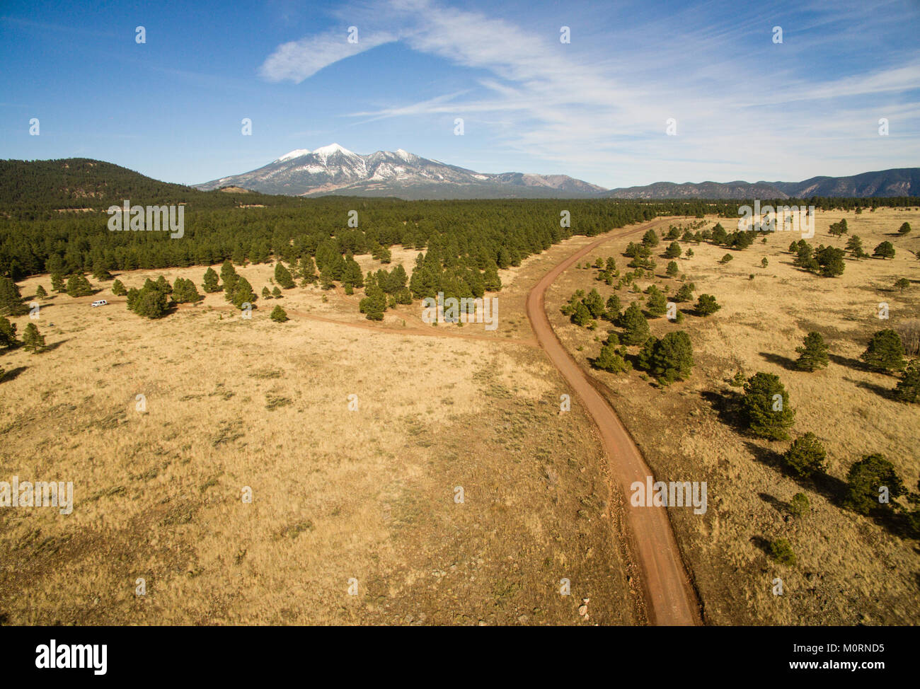 Birds Eye View of gravel dirt road heading in towards Humphrey’s Peak ...