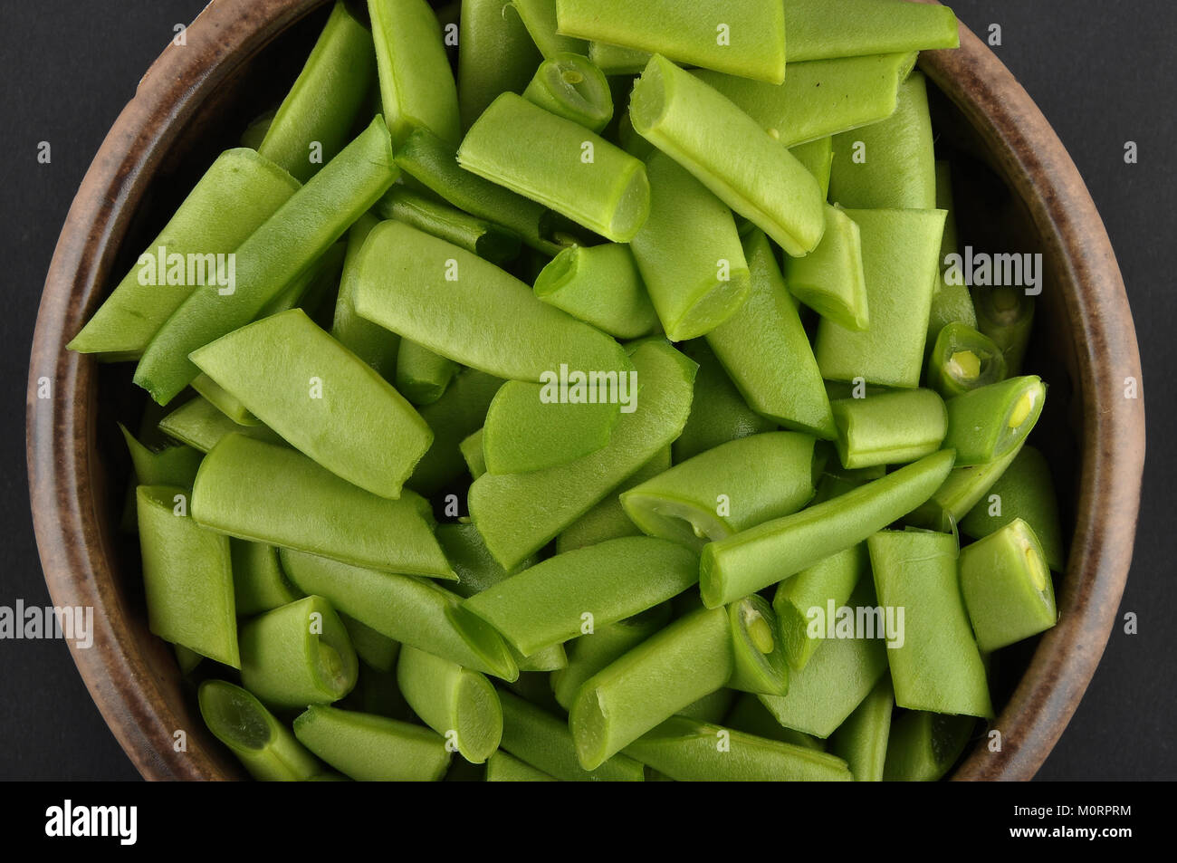 Common beans cut in bowl Stock Photo - Alamy