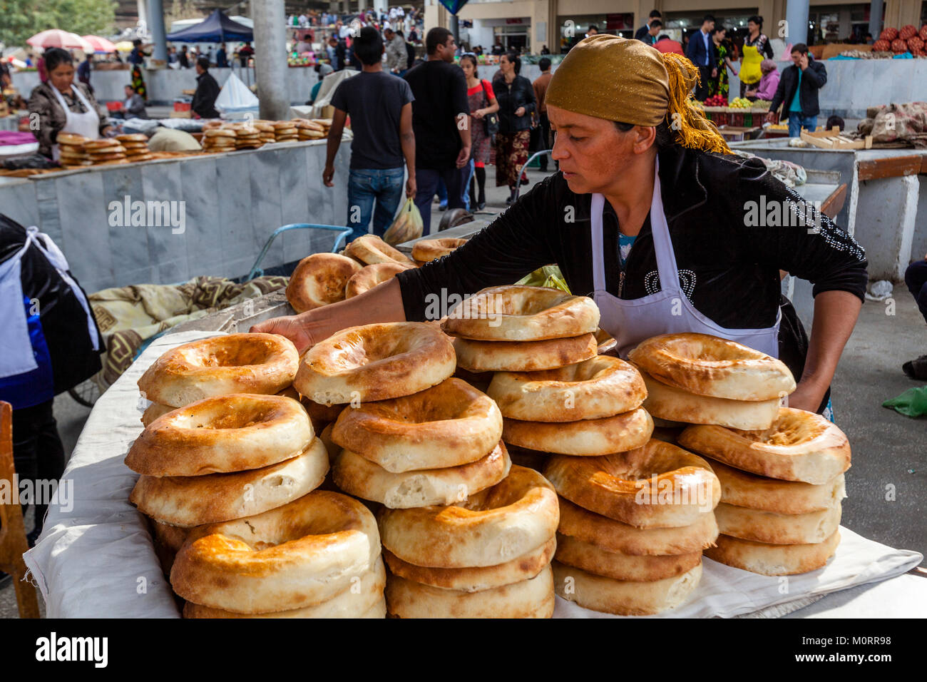 An Uzbek Woman Selling Traditional Bread At The Main Bazaar, Samarkand ...