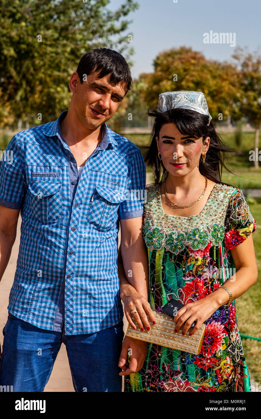 A Young Uzbek Couple (female in traditional costume) Pose For A Photo ...
