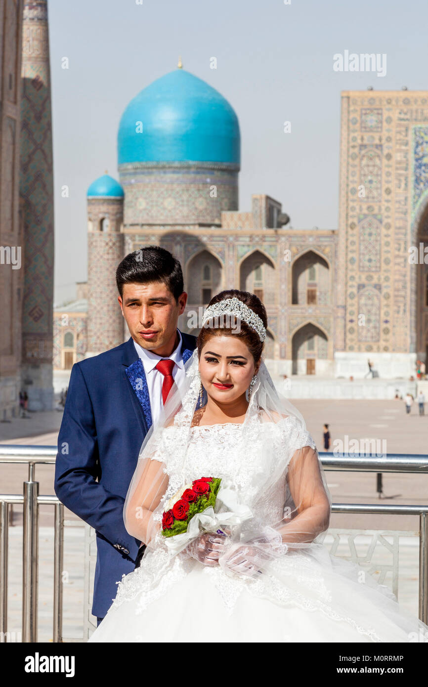 A Young Couple Pose For Their Wedding Photos At The Registan Complex ...