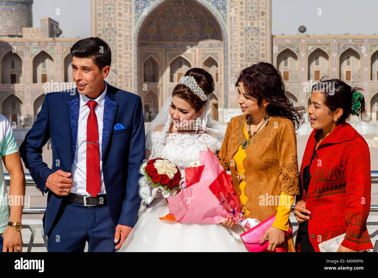 A Young Couple Get Ready To Pose For Their Wedding Photos At The ...