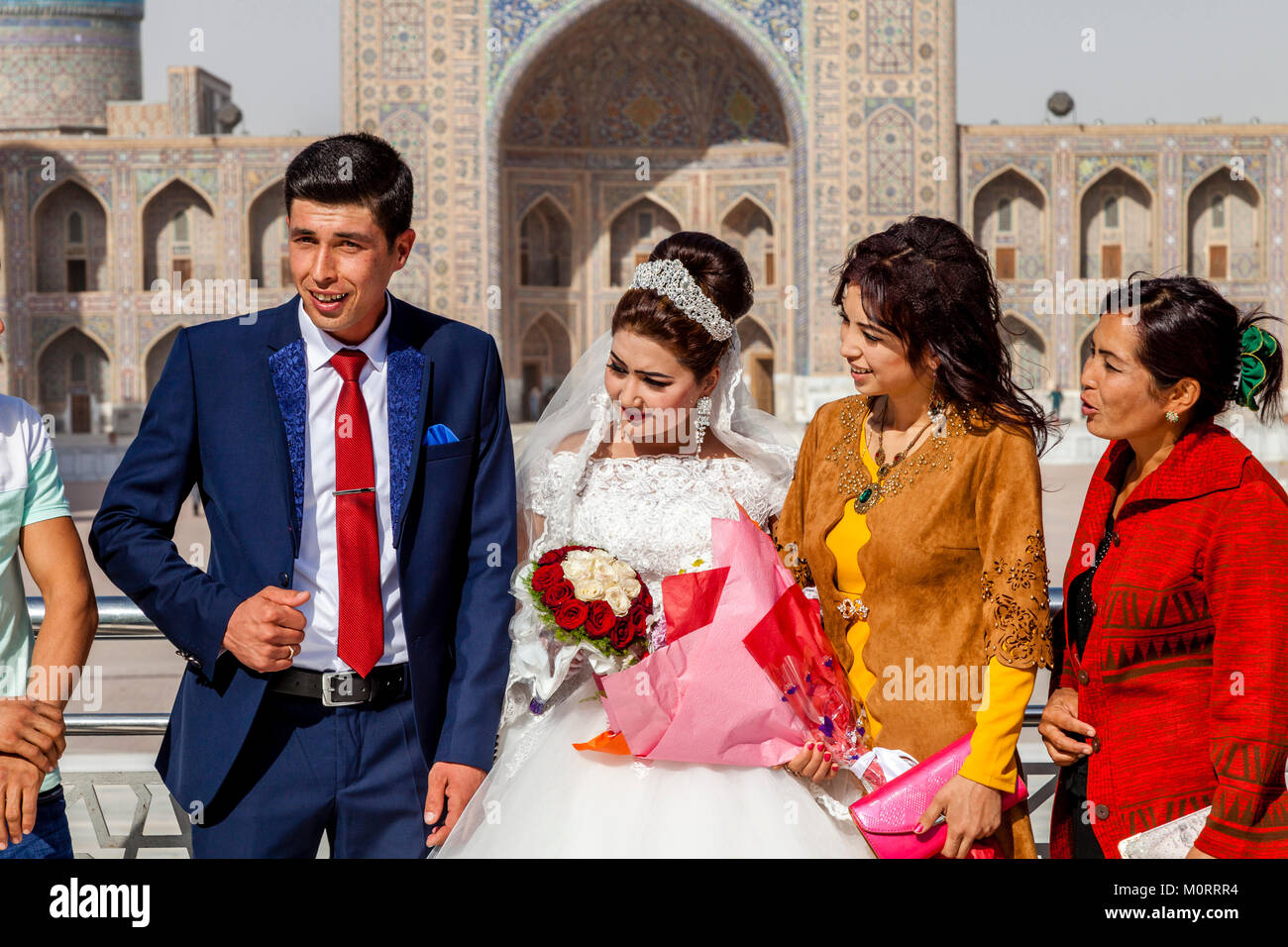 A Young Couple Get Ready To Pose For Their Wedding Photos At The ...