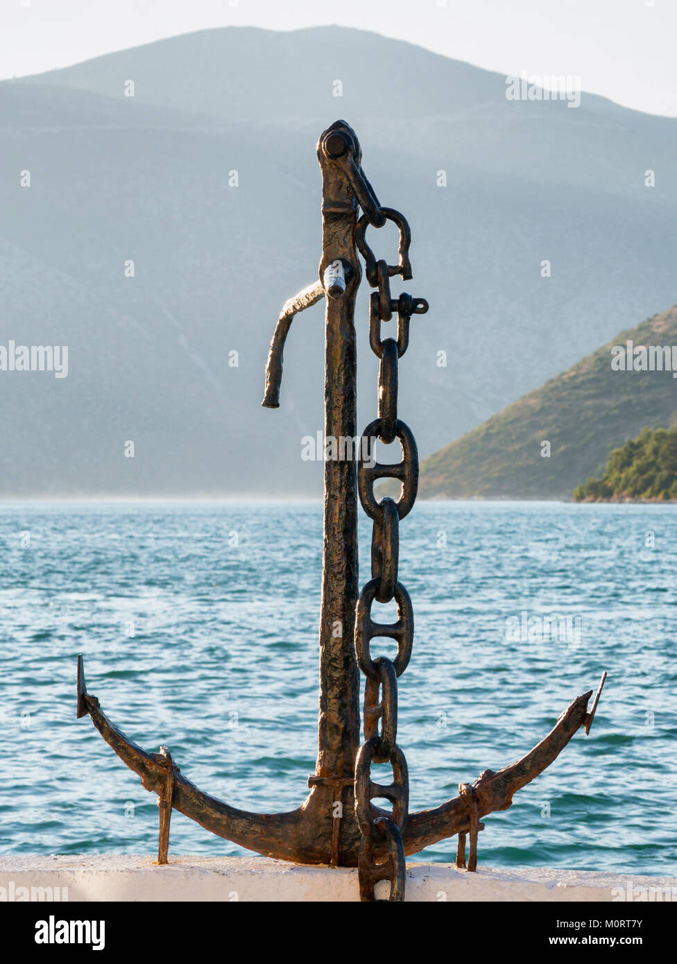 old anchor as a decoration of a small port in a greek island Stock ...