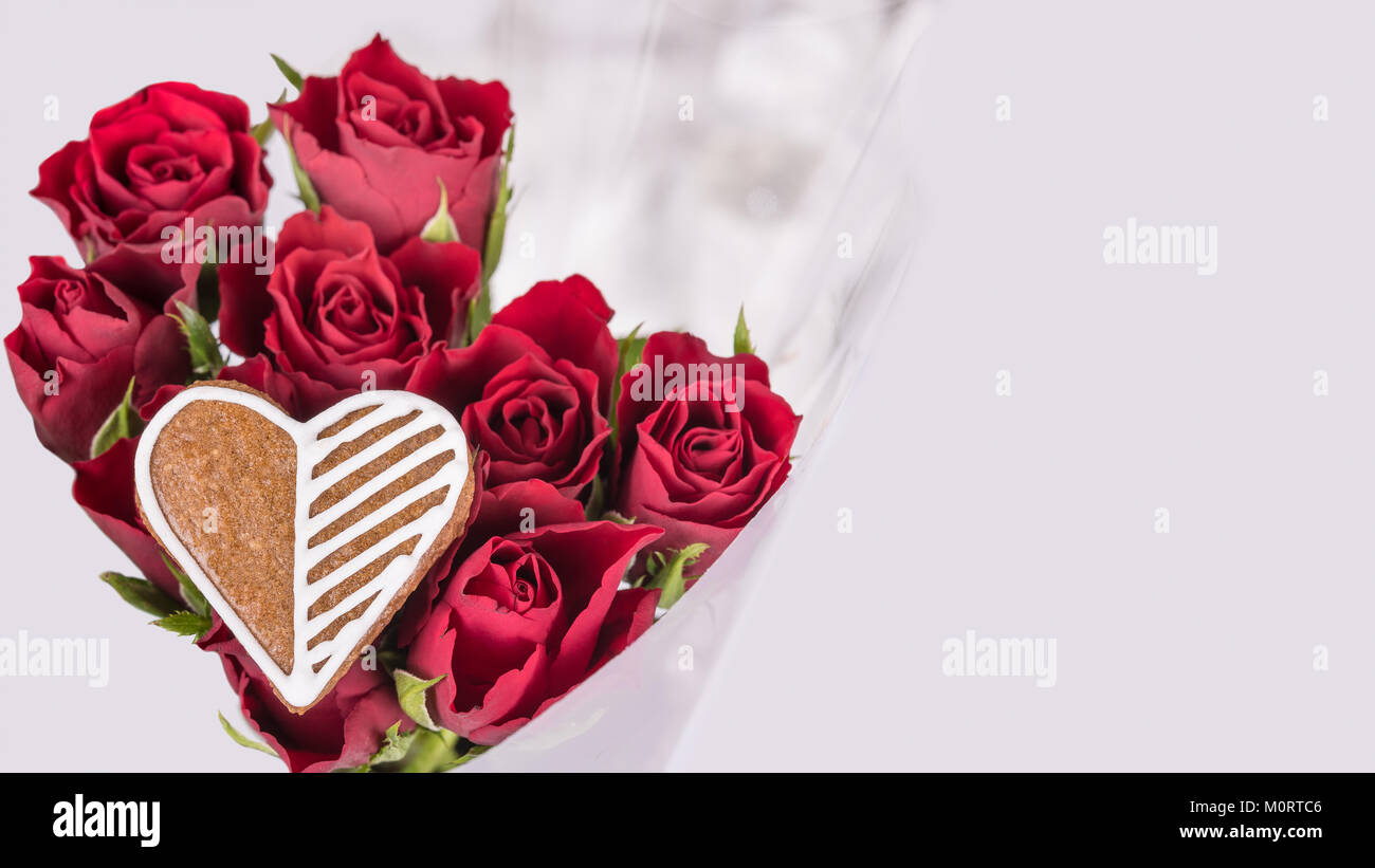 Bouquet of red roses and sweet heart for good luck. Floral Valentine's ...