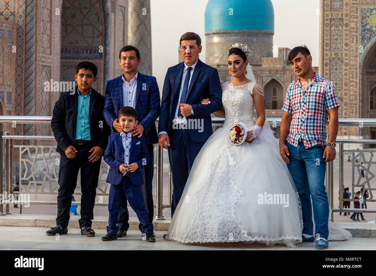 A ‘Just Married’ Young Couple Pose For Wedding Photos At The Registan ...