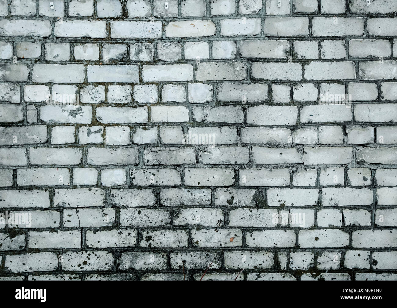 Old white brick wall of an abandoned building stained clay Stock Photo ...