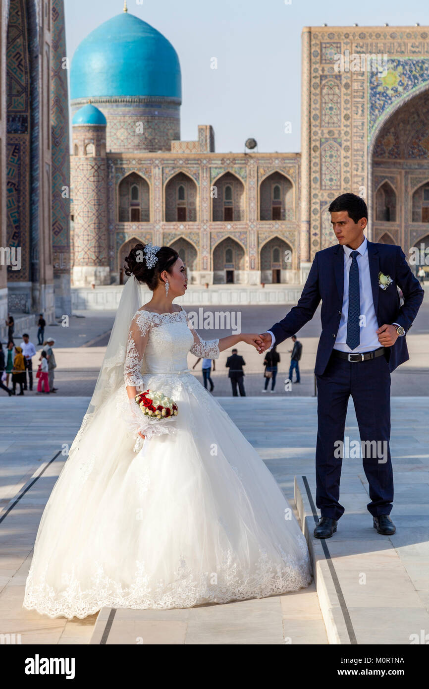 A ‘Just Married’ Young Couple Pose For Wedding Photos At The Registan ...