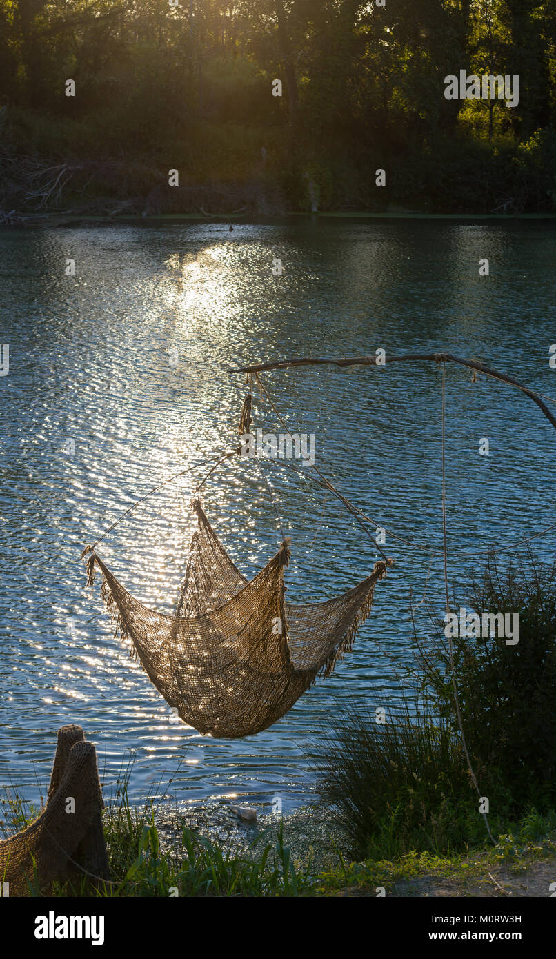 Fishing net commonly called "scale" hanging from a stick Stock Photo ...