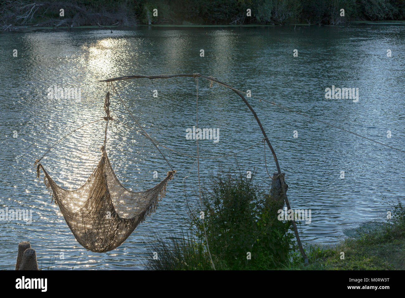 Fishing net commonly called "scale" hanging from a stick Stock Photo ...