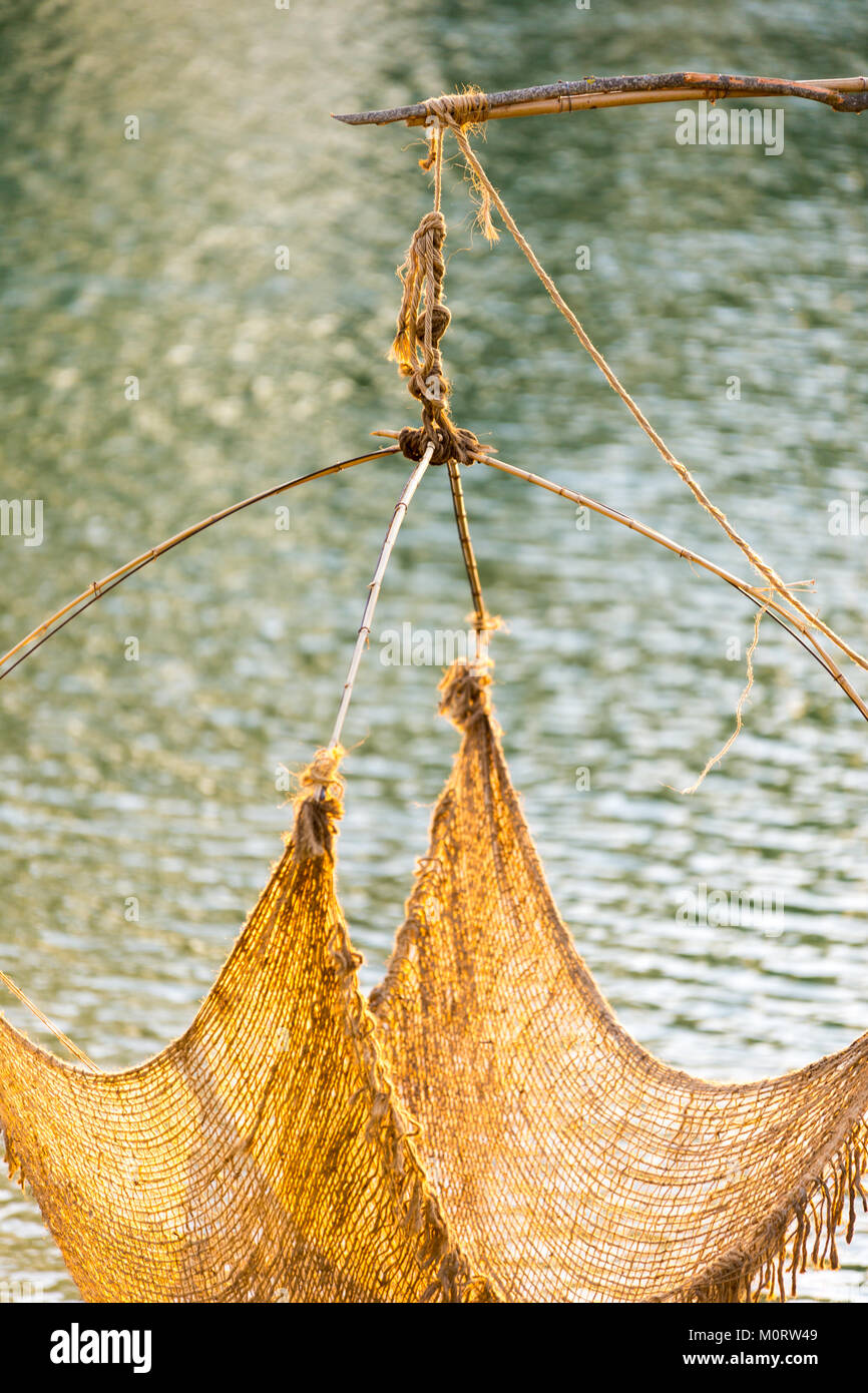 Fishing net commonly called "scale" hanging from a stick Stock Photo ...