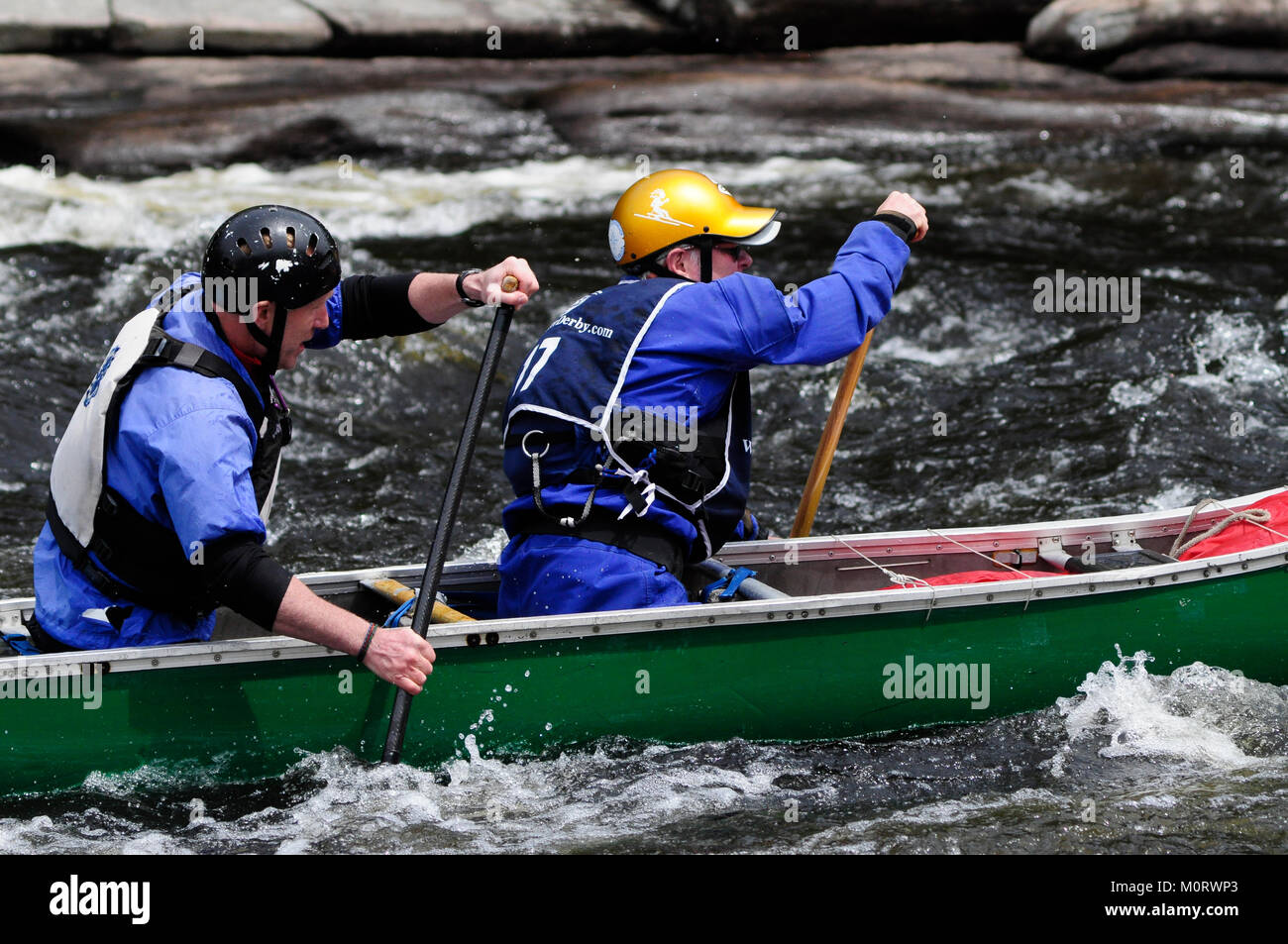 Two Men Paddling An Open Canoe In The Hudson White Water Derby ...