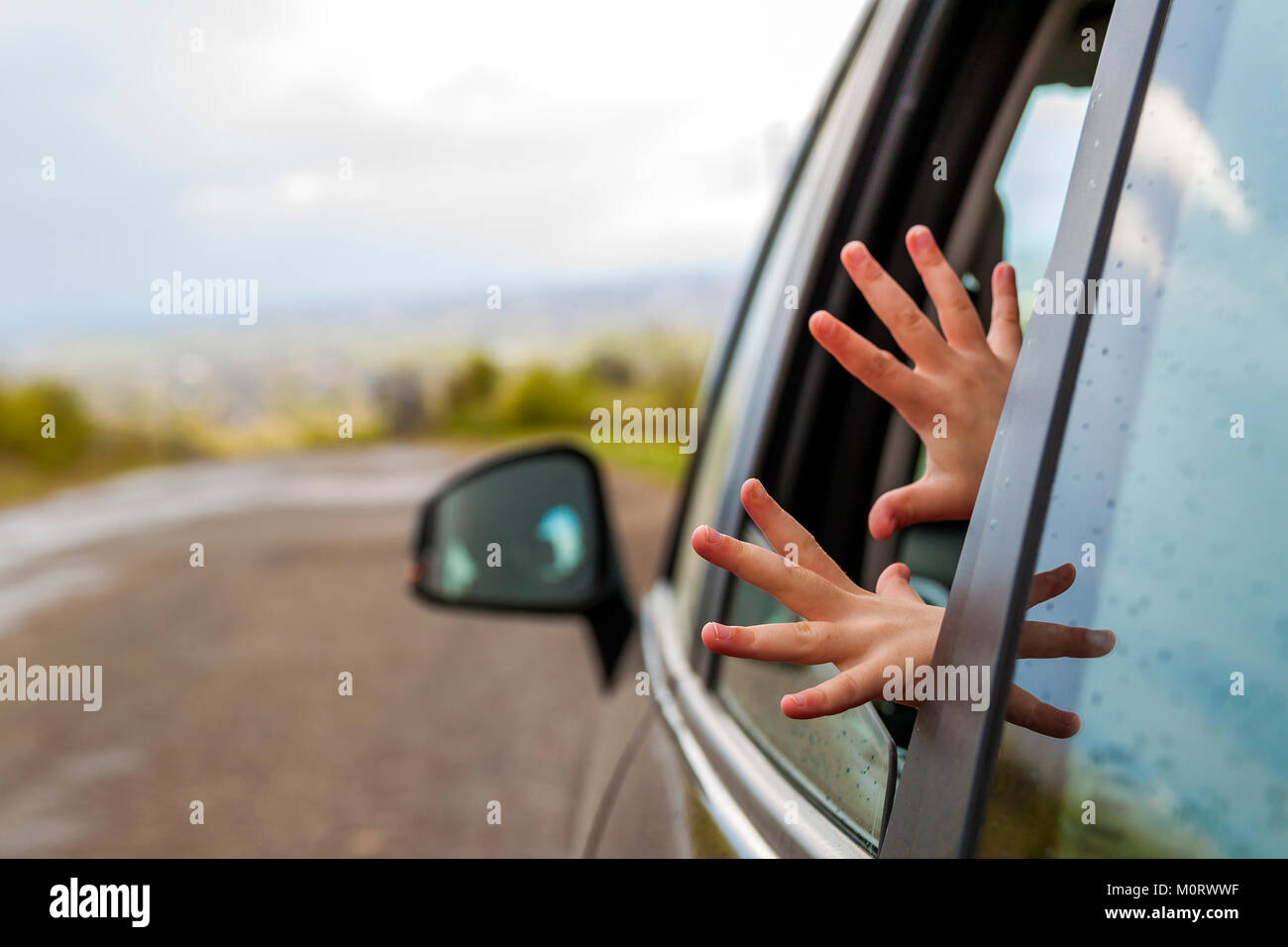 Child hands in a car window during travel to vacation Stock Photo - Alamy