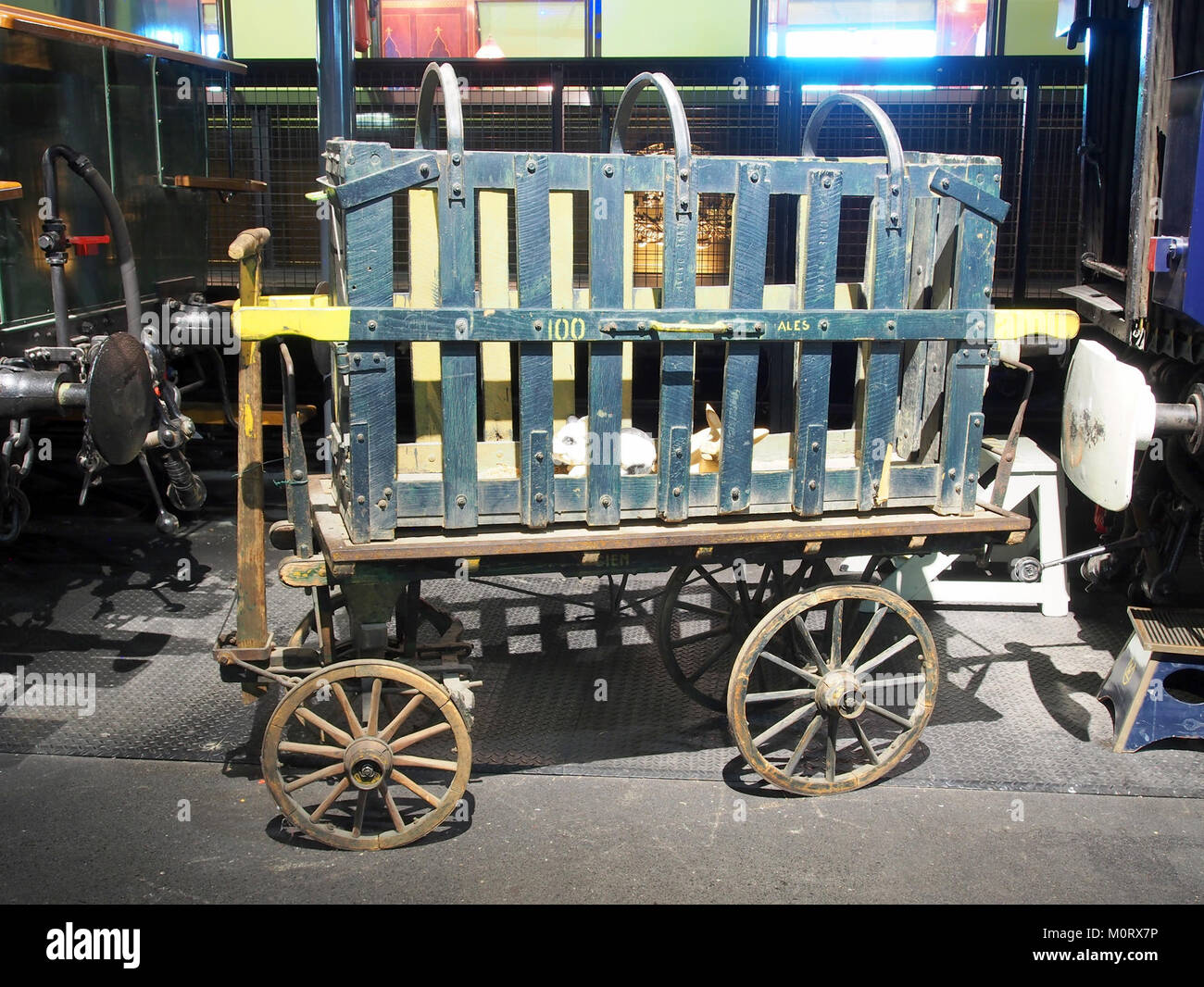 This photograph depicts a cart designed for transporting animals ...