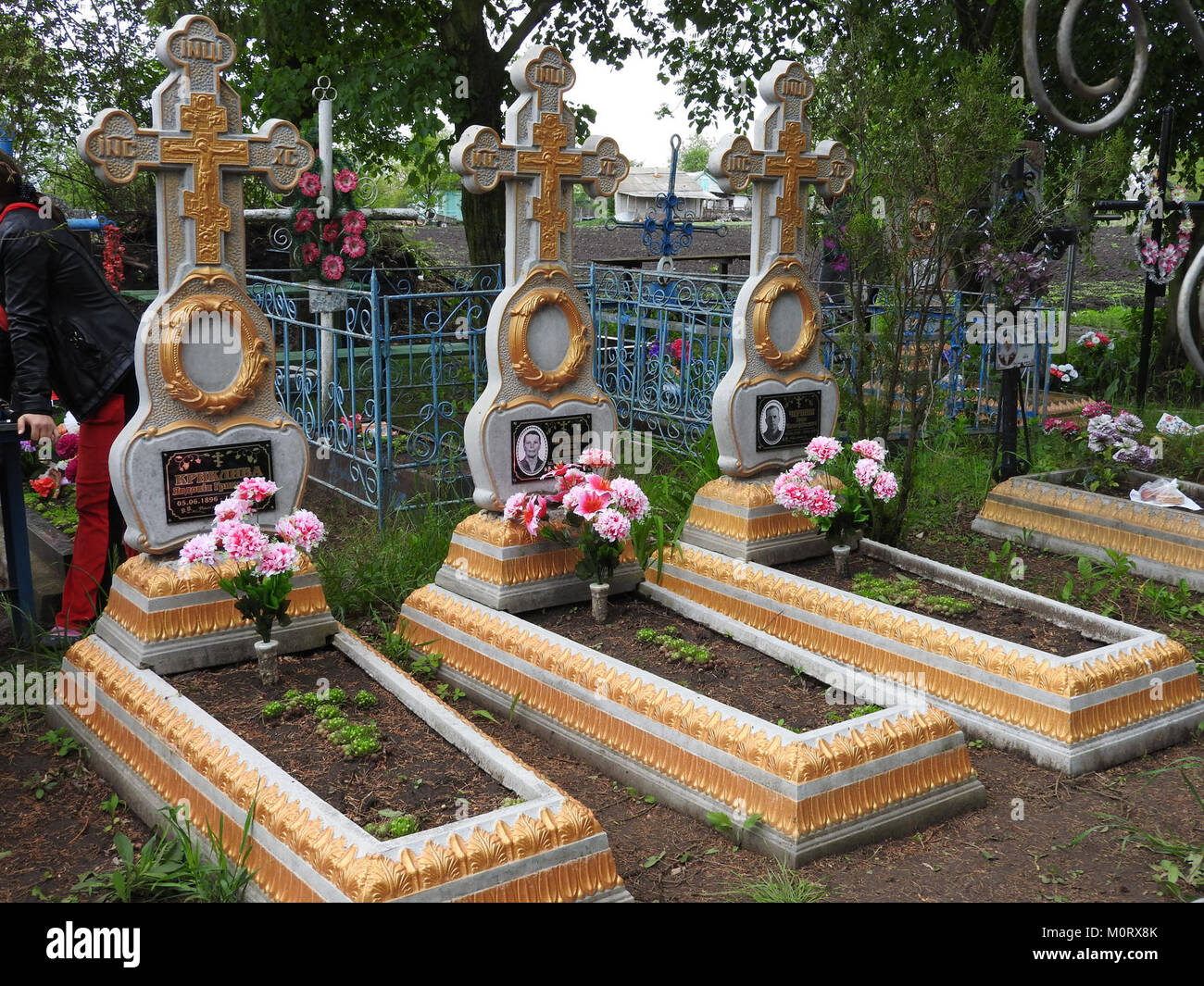 This image shows a cemetery in Bilylivka, a town in Ukraine. The ...