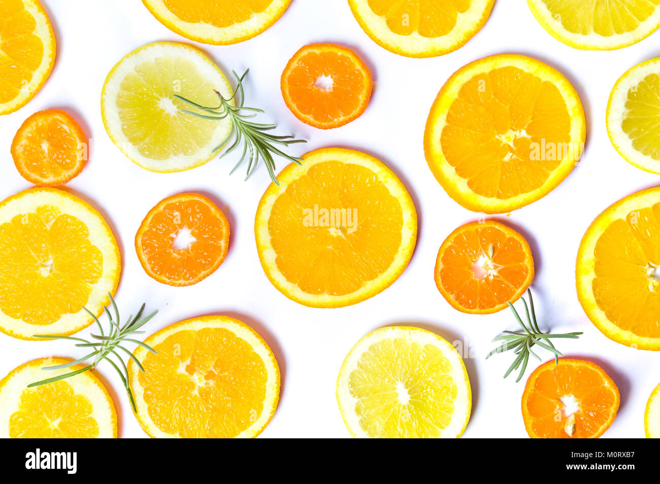 Sliced oranges and lemon with rosemary pattern flay lay Stock Photo - Alamy