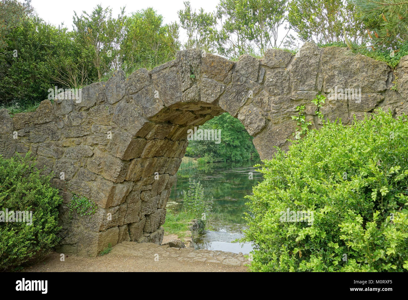 This photograph captures the cascade and artificial ruins located in ...