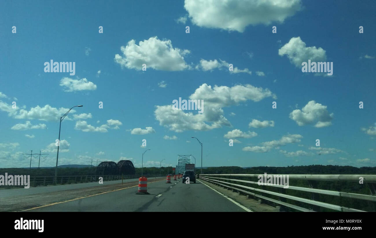 A photograph of Castleton Bridge, taken from a distance, highlighting ...