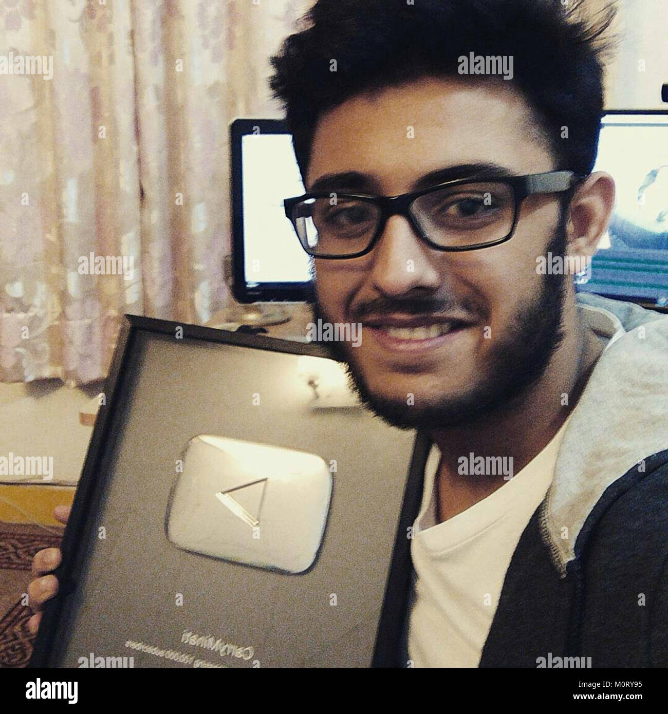 CarryMinati, a popular Indian YouTuber, holds his silver play button ...