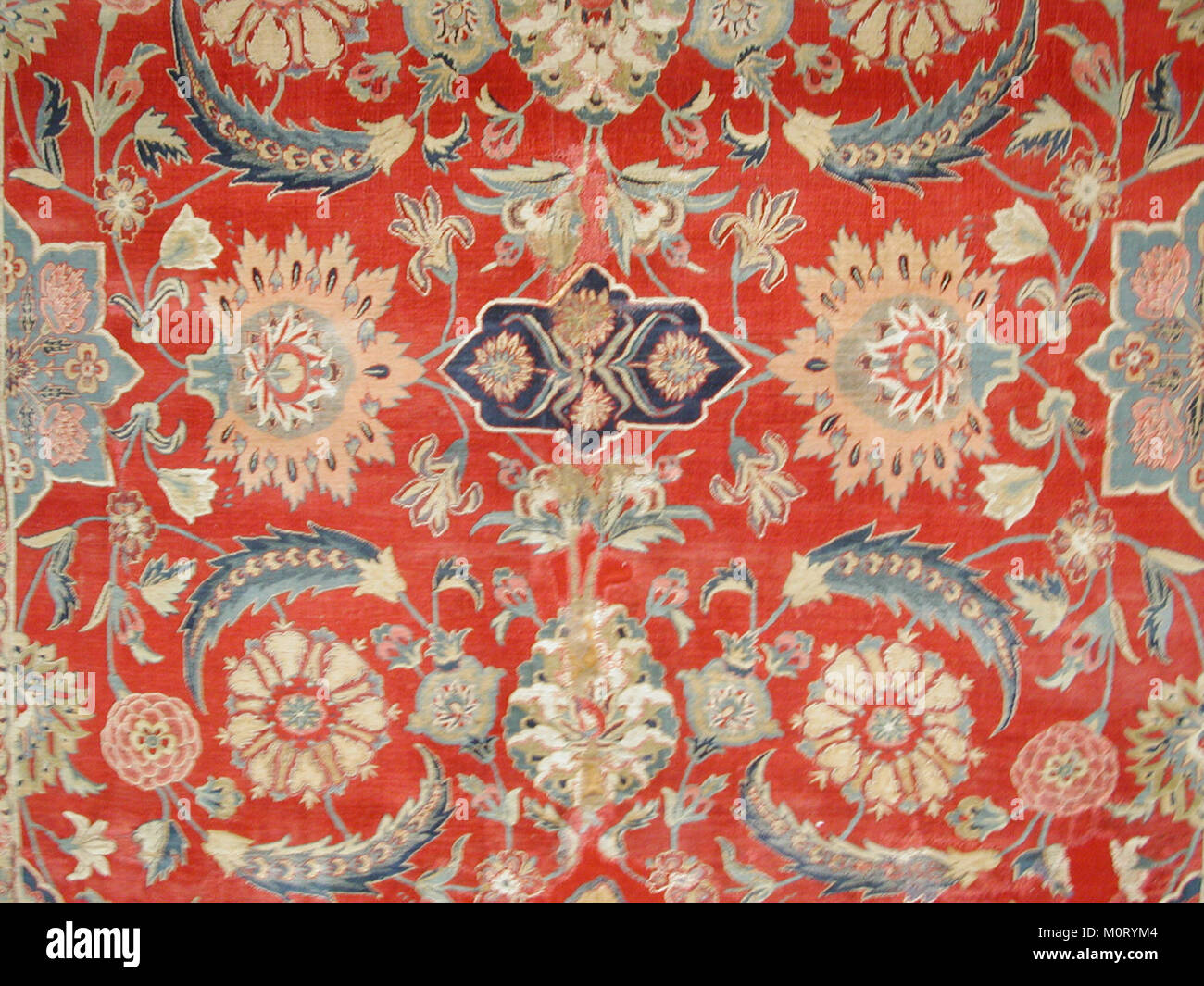 This 16th-century carpet, with intricate scrolling vines and blossoms ...