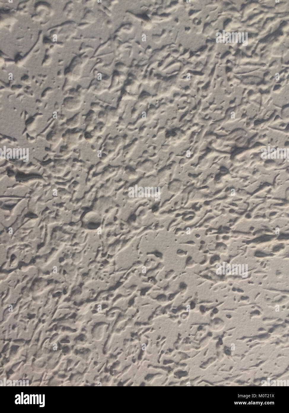 A close-up image showing a textured ceiling design, featuring intricate ...