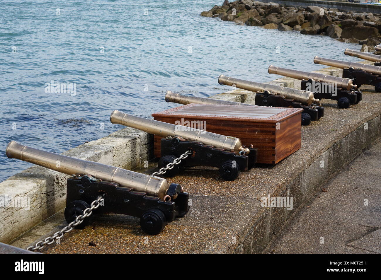 Gold cannons by the sea Stock Photo - Alamy