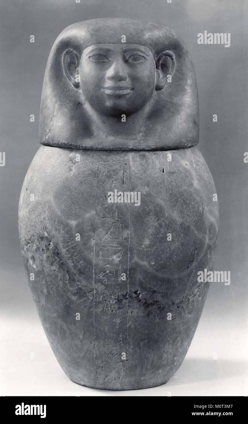 A canopic jar featuring a human-headed lid, commonly used in ancient ...