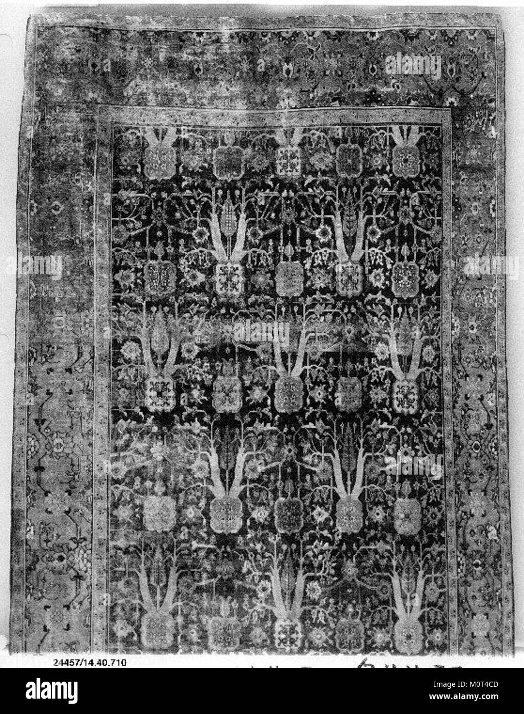 This carpet features a repeating tree design and is part of the ...