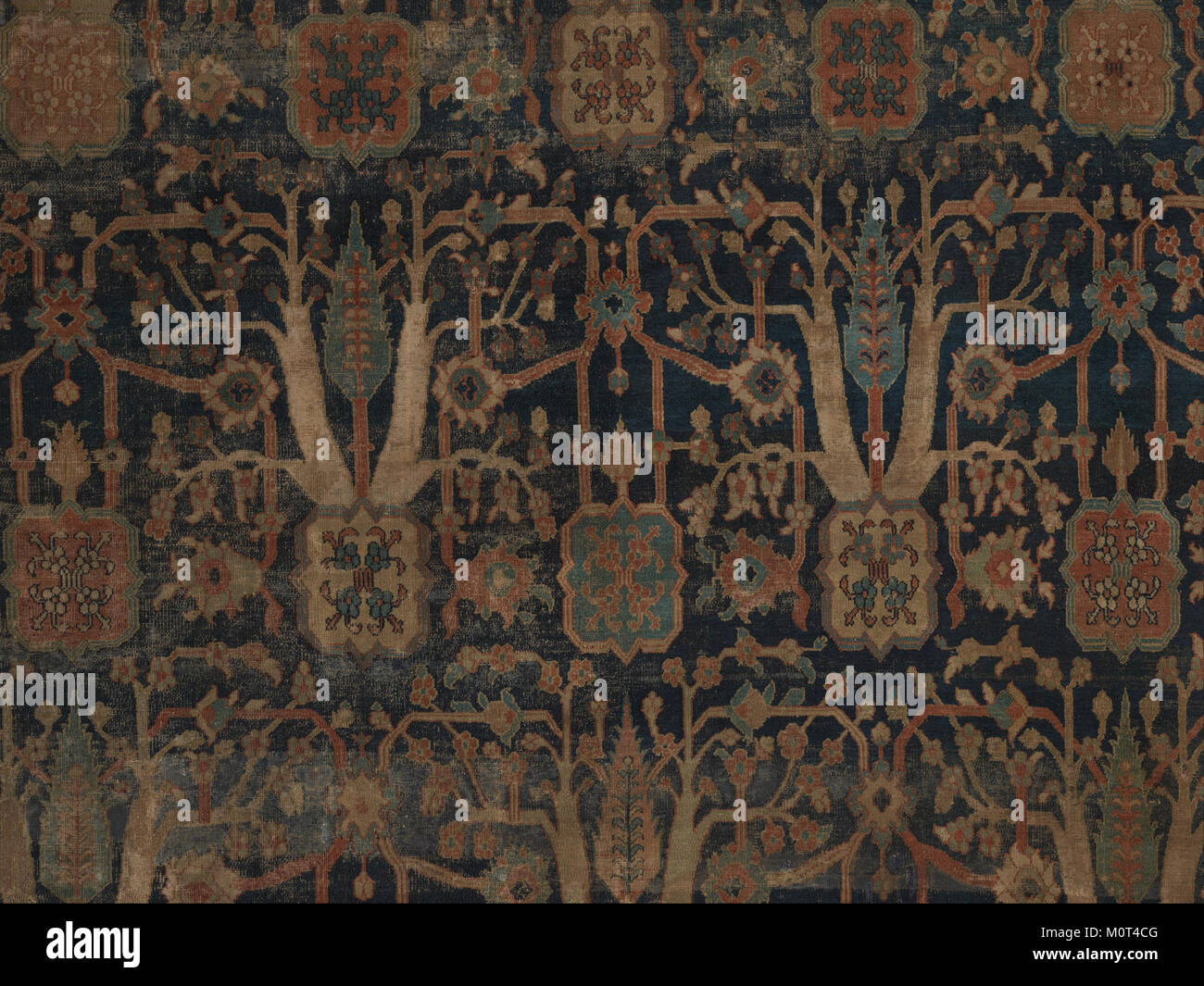 This carpet features a repeating tree design, a notable example of ...