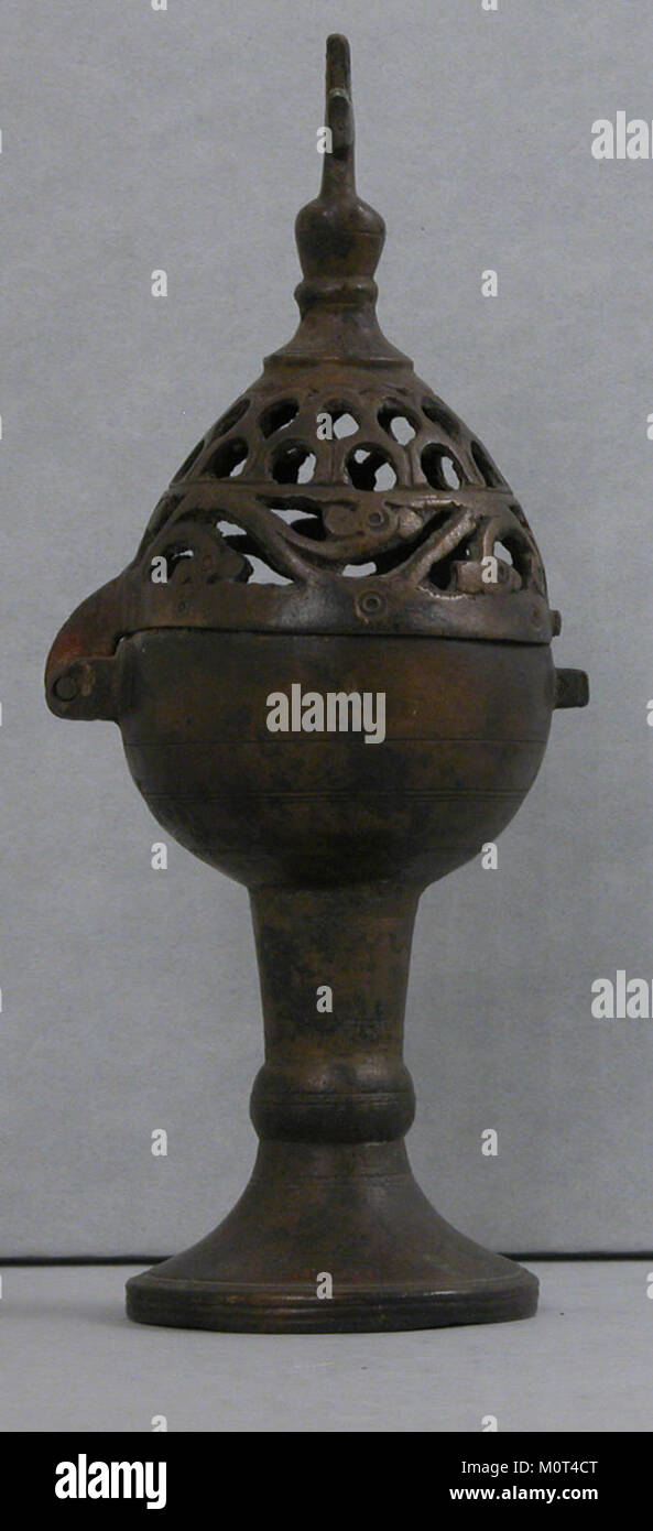 This censer, an ancient vessel used for burning incense, is part of the ...
