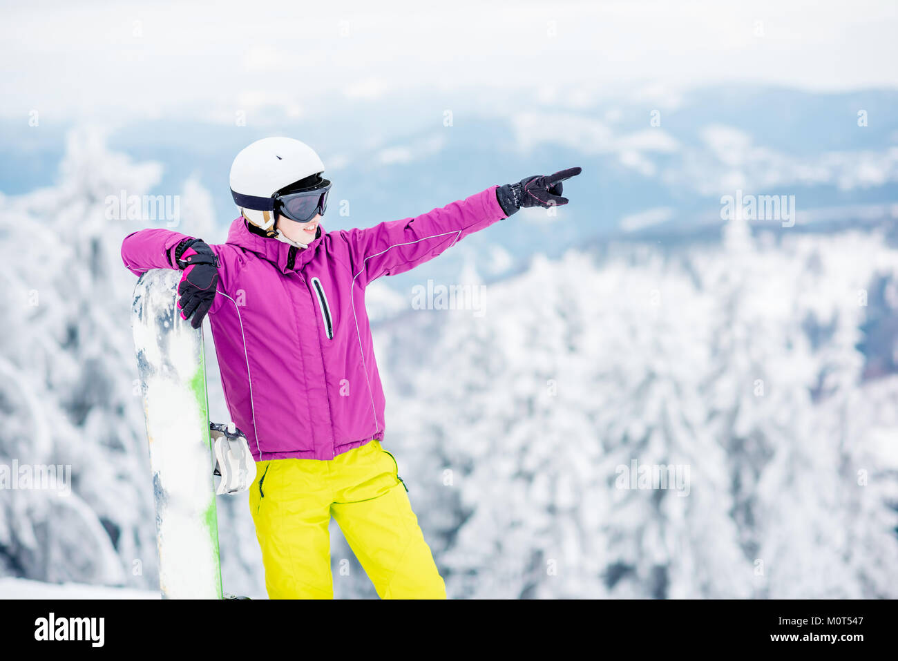 Young beautiful woman snowboarder hi-res stock photography and images ...