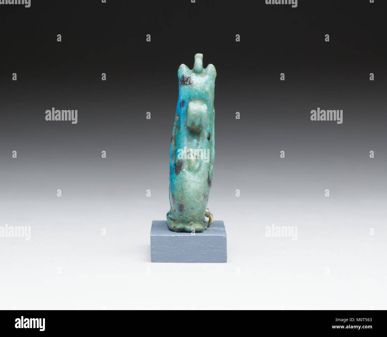 This amulet featuring a cat with kittens is a piece of ancient jewelry ...