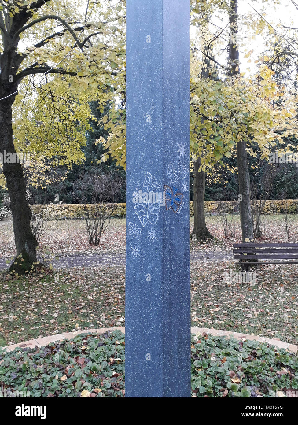 This image depicts a historical cemetery in Apolda, Germany, showing ...