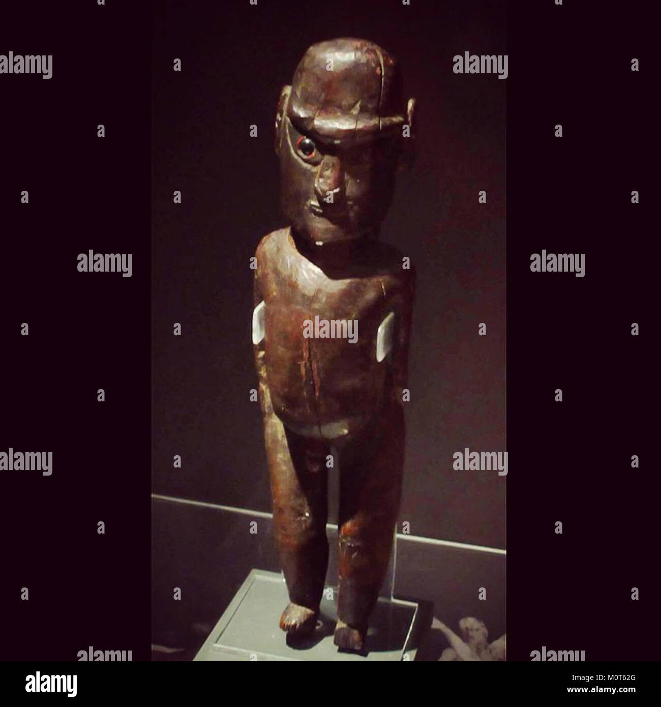 The carved wooden figure is an intricate piece of art, likely of ...