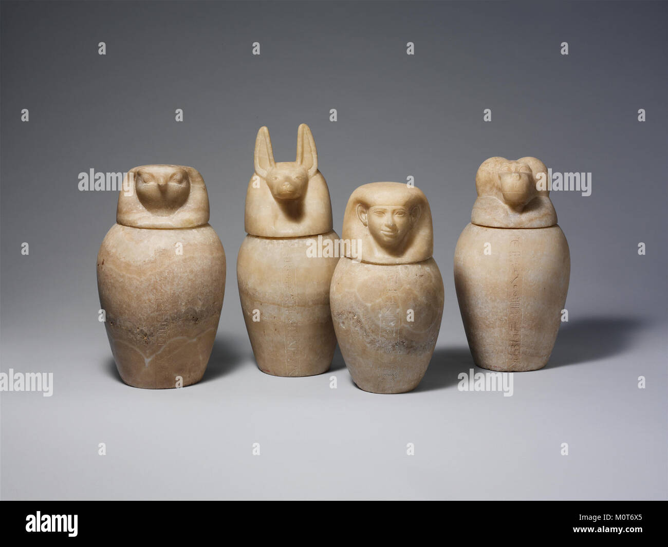 A canopic jar featuring a baboon-headed lid, representing the god Hapy ...