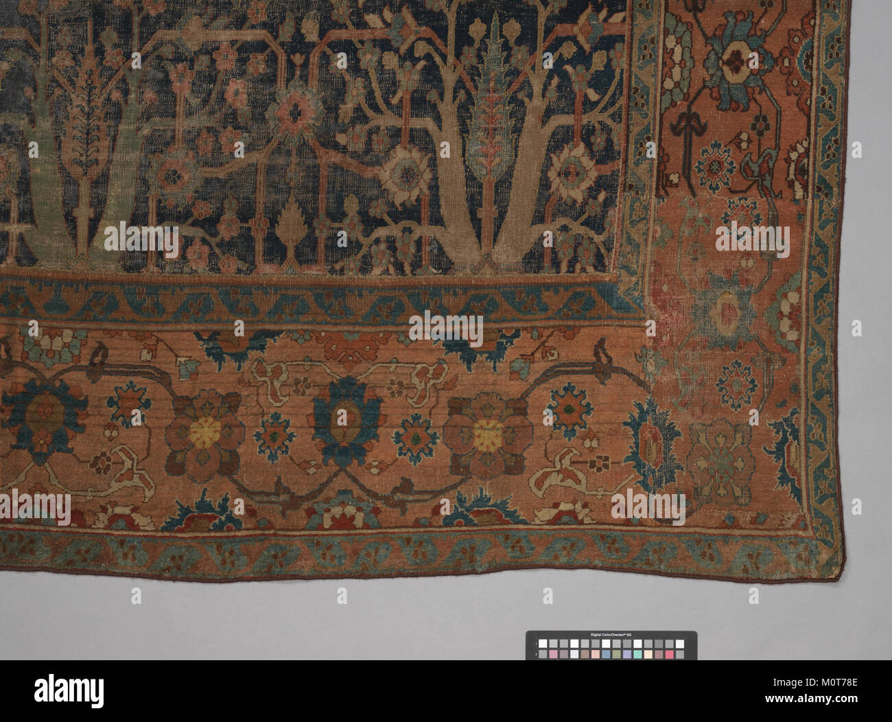 This carpet, featuring a repeating tree design, showcases traditional ...