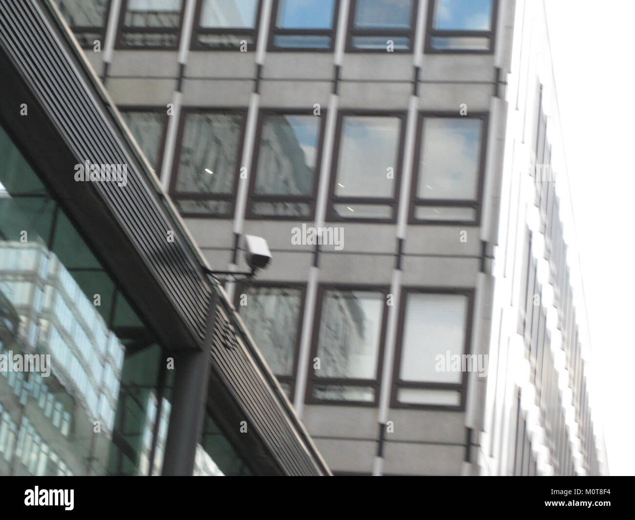 This image shows a CCTV camera in London, reflecting the city's ...